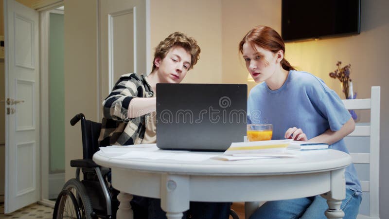 Two Friends are Discussing and Watching Something on the Computer ...