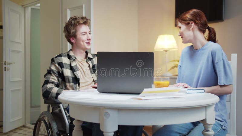 Two Friends are Discussing and Watching Something on the Computer ...