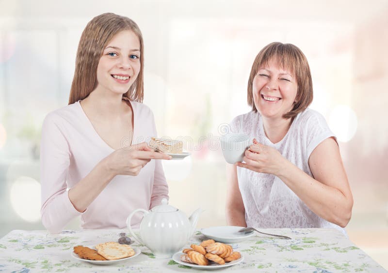 Two Friends Drink Tea and Talk Stock Photo - Image of young ...