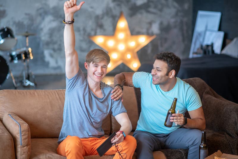 Two Friends Drinking Beer and Having a Good Time Stock Photo - Image of ...