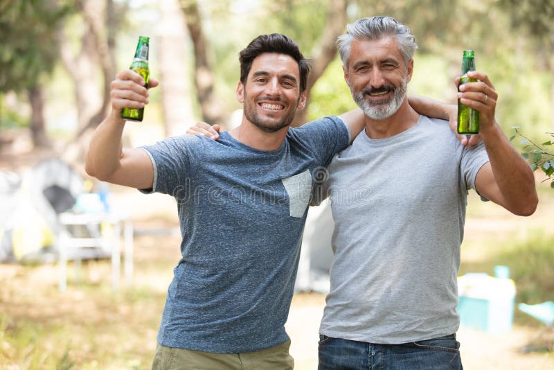 Two Friends Drinking Beer Outdors Stock Image - Image of hipster ...