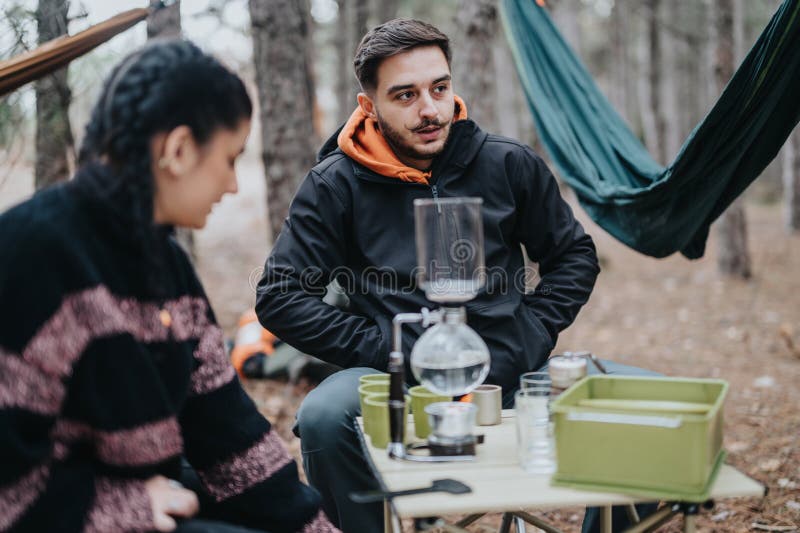 Two Friends Engaging Outdoors in a Relaxed Camp Setting Stock Image ...