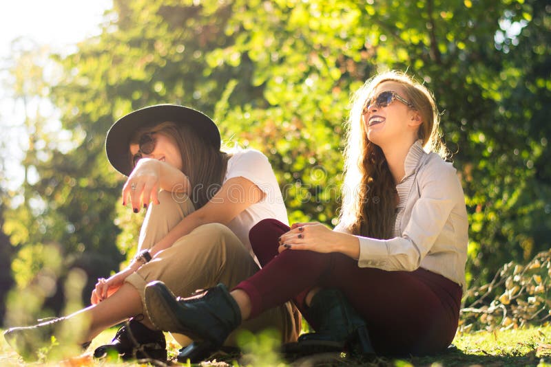 Two Friends Enjoying Autumn Day in the Park Stock Photo - Image of ...
