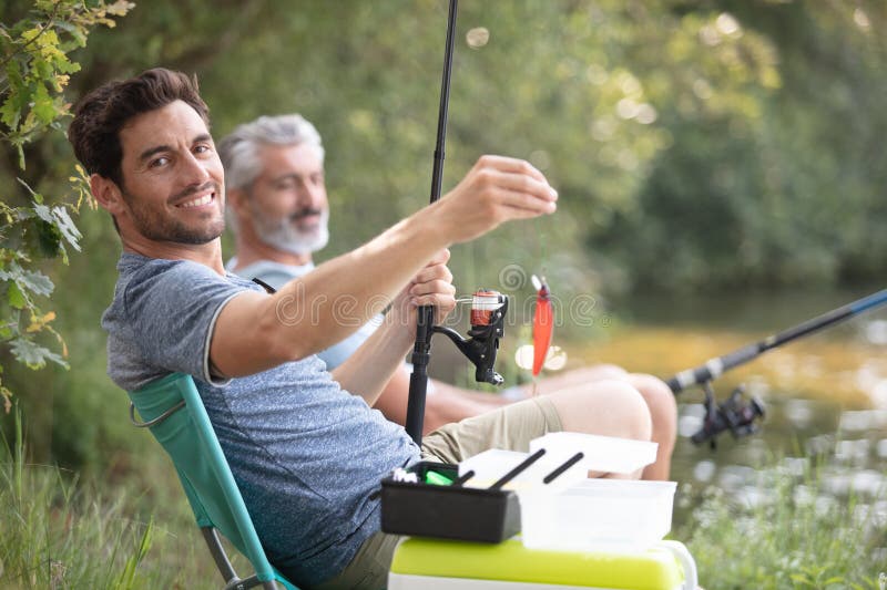 Two Friends Fishing Together Stock Image - Image of sunset, catch ...