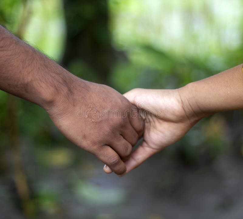 Two Friends are Hand-shaking, One with White Hands and the Other with ...