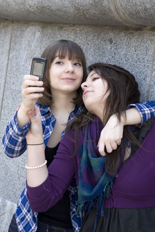 Two Friends Having a Blast with a Phone Stock Photo - Image of ...