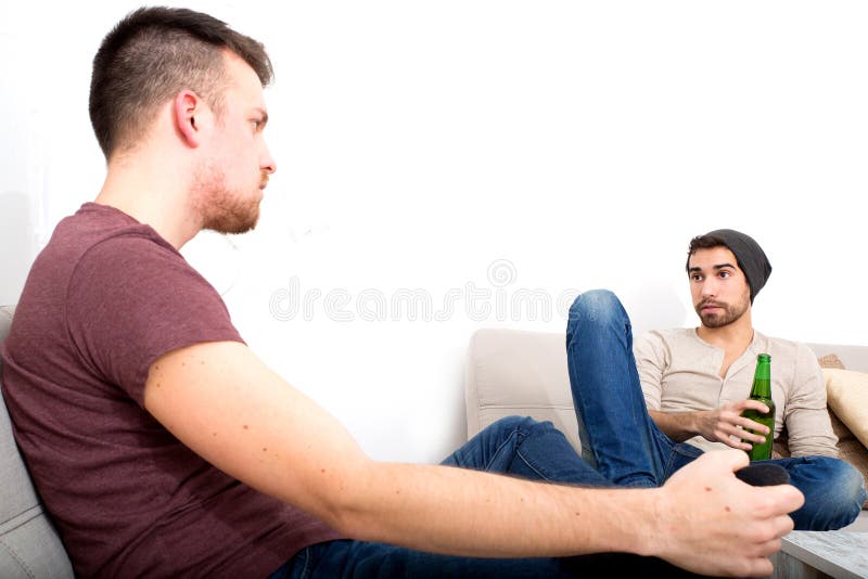 Two Friends Having a Conversation in the Living Room Stock Photo ...