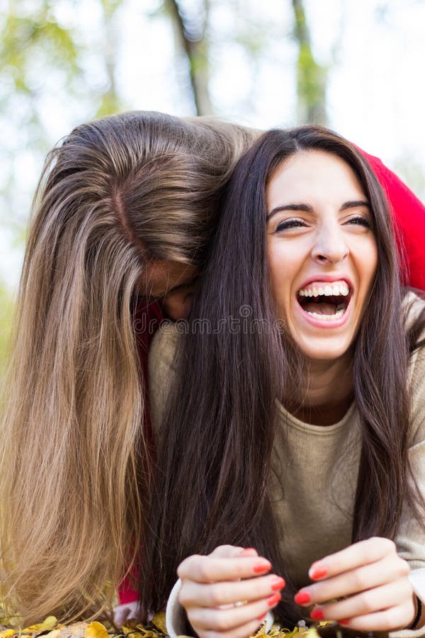 Two Friends Joking and Laughing, in the Park Stock Image - Image of ...
