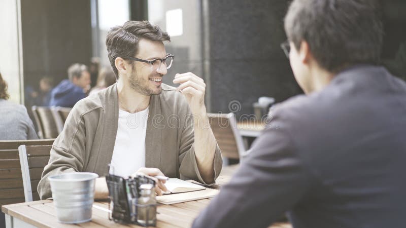 Two Friends are Laughing at Table of the Cafe Outdoors Stock Photo ...