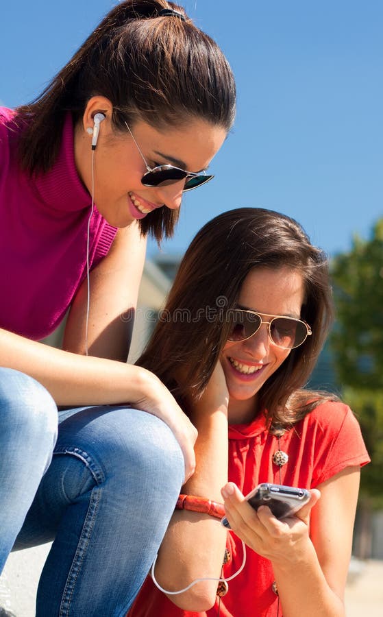 Two Friends Listening To Music Stock Image - Image of observing ...