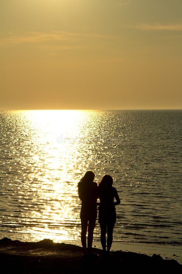 Two Friends Looking at Sunset Stock Photo - Image of people, teenager ...