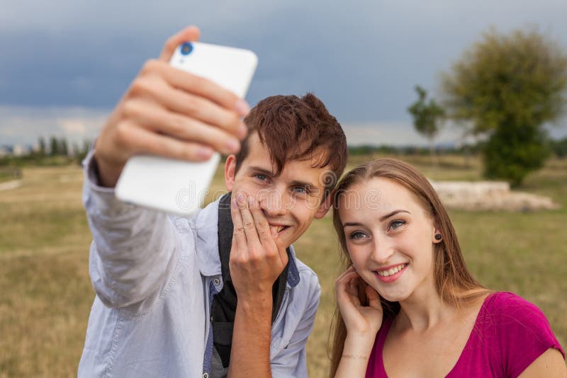 Two Friends with Mobile Phone Taking Selfies. Summer Time. Stock Image ...