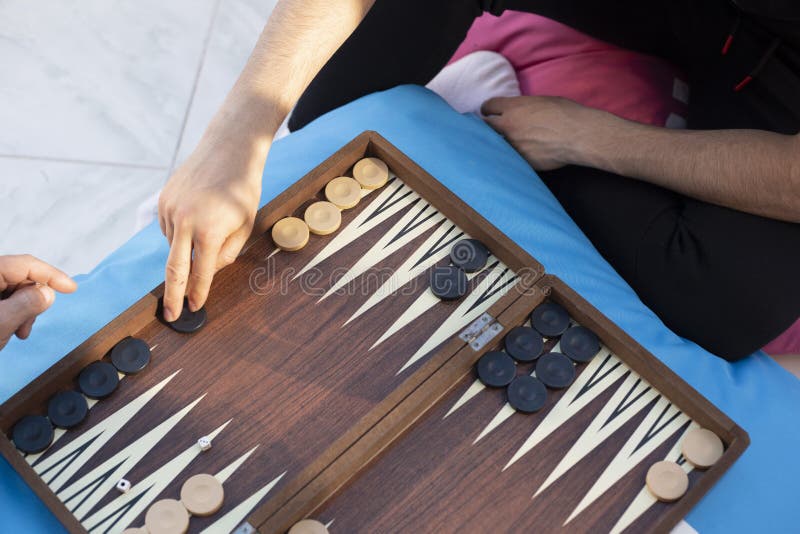 Two Friends Playing Backgammon at Home Stock Photo - Image of enjoyment ...
