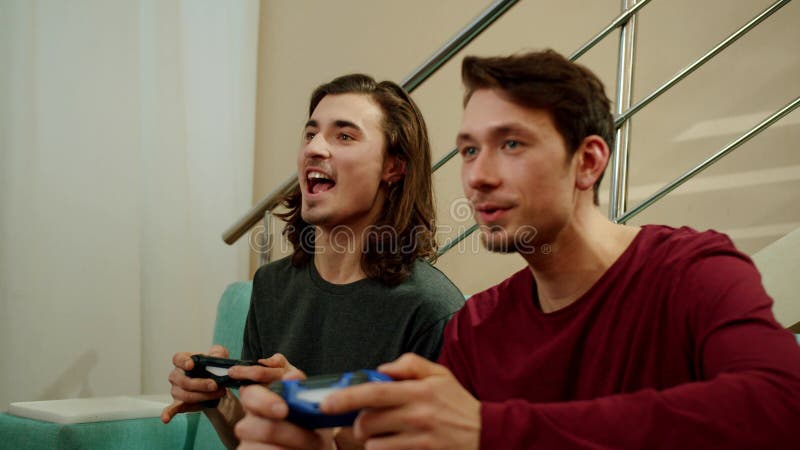 Two Friends are Playing Games and Laughing Stock Photo - Image of ...