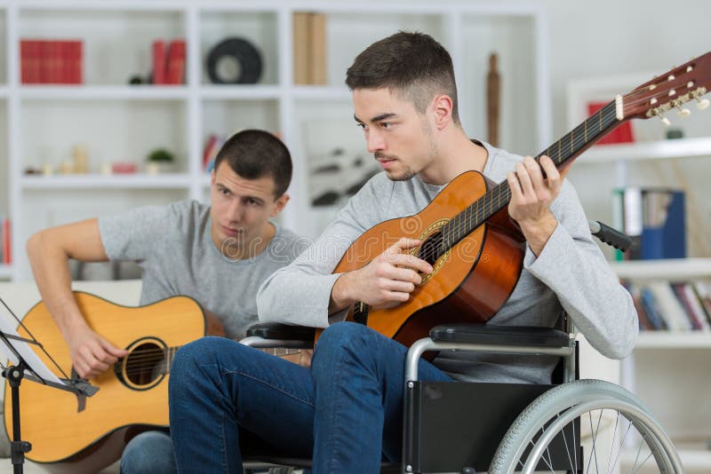 Two friends playing guitar stock photo. Image of happiness - 270025176