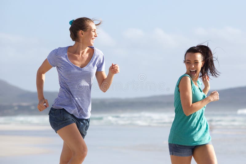 Two Friends Running in Summer at the Beach Stock Image - Image of coast ...