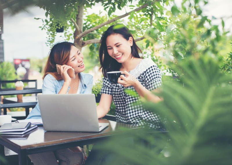 Two Friends Smiley Enjoying Working Together in a Coffee Shop. Stock ...