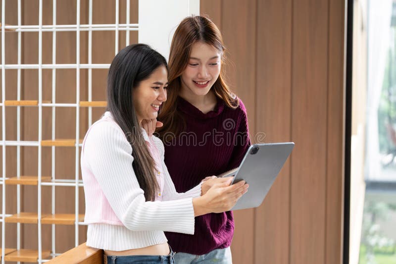 Collaboration and Communication. Two College Students Work Together on a Project, Showing ...