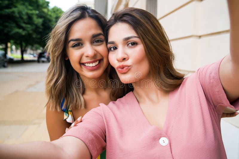Two Friends Taking a Selfie Outdoors. Stock Image - Image of urban ...
