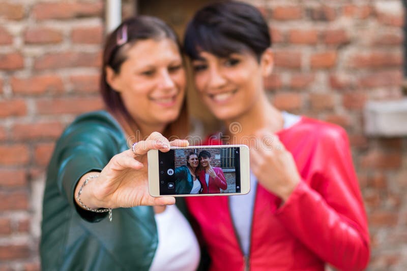 Two Friends are Taking a Selfie in a Urban Street Stock Image - Image ...