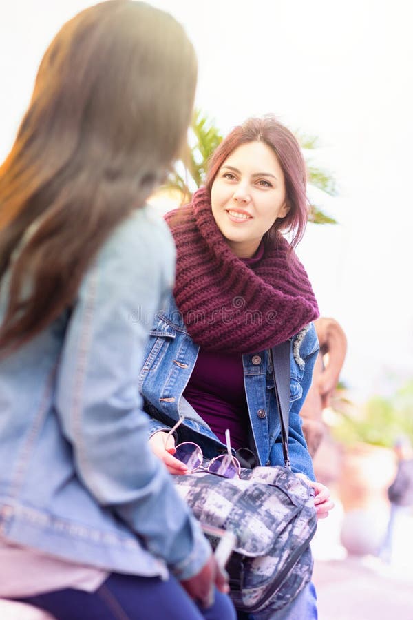 Two Friends Talk Sitting on a Bench Stock Photo - Image of modern ...