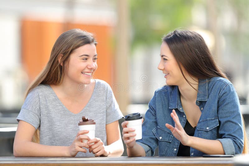 Two Teenage Friends Talking In The Park Stock Photo - Image of ...