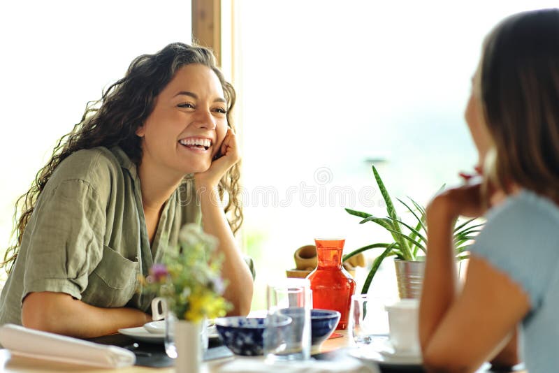 Two Friends Talking in a Restaurant Stock Image - Image of good, adults ...