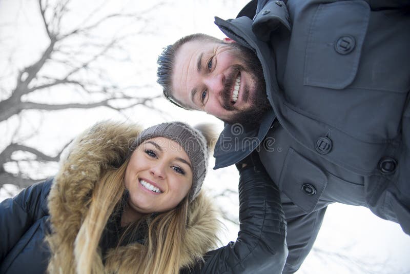 Friends in Winter Coats Sitting Fire in Forest Stock Photo - Image of ...