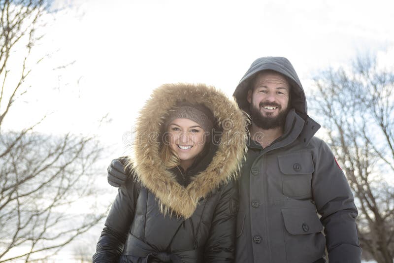 Friends in Winter Coats Sitting Fire in Forest Stock Photo - Image of ...