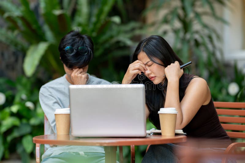 Two Frustrated Asian People Sitting Front Laptop Struggling Their ...