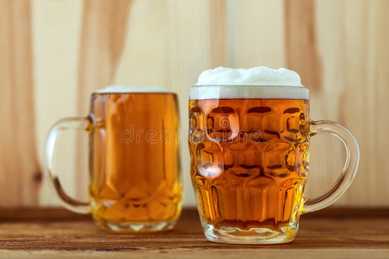 Two Full Jugs of Beer on Bar Counter Stock Image - Image of wooden ...