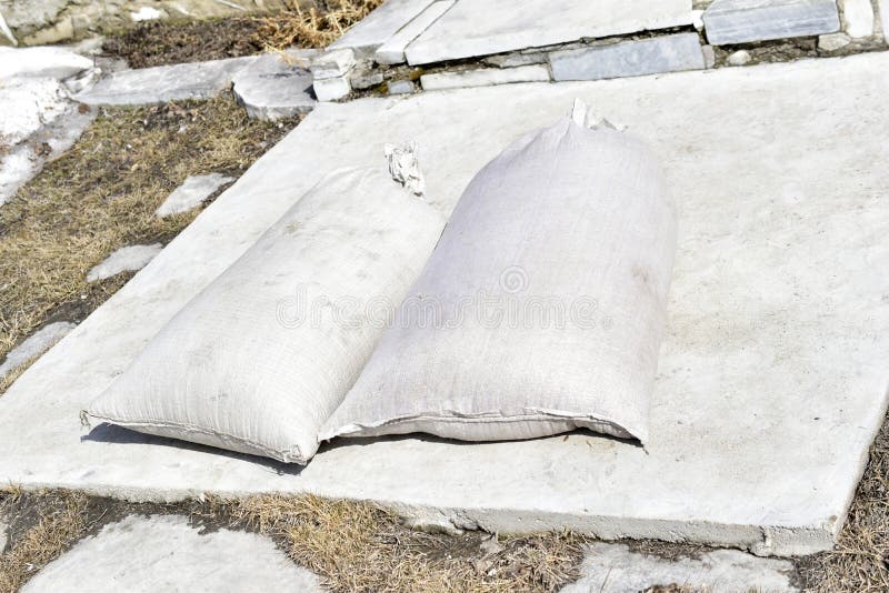 Two Full Sacks of Grain on the Ground in the Yard Stock Image - Image ...