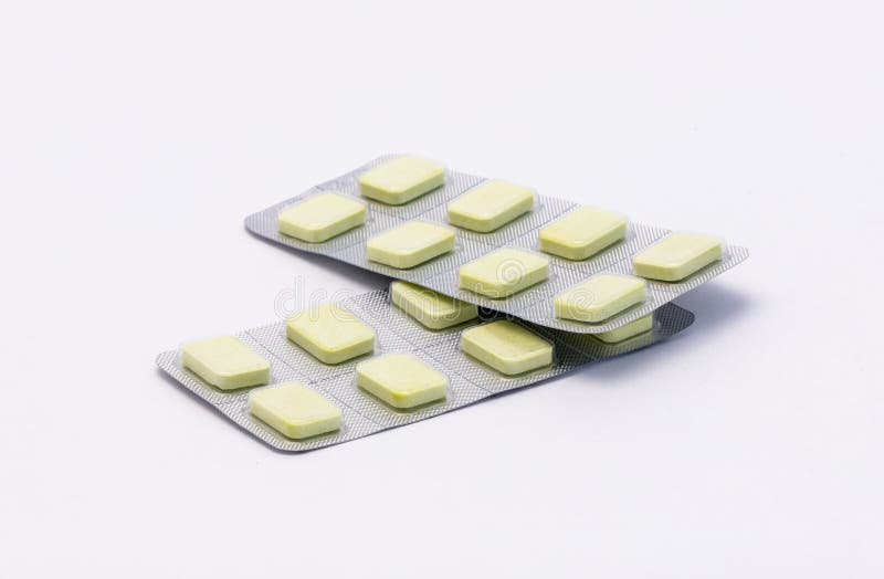 Two Full Sealed Packages with White Rectangular Tablets Lie on a White ...