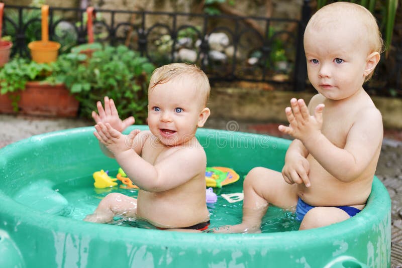 Two Funny Babies in the Pool Stock Image - Image of activity, colorful ...
