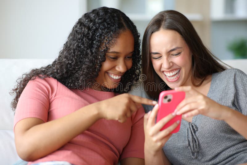 Two Funny Friends Chacking Phone Content Stock Photo - Image of ...