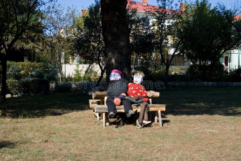 Two Funny Puppets Sitting in a Park Bench Stock Photo - Image of ...