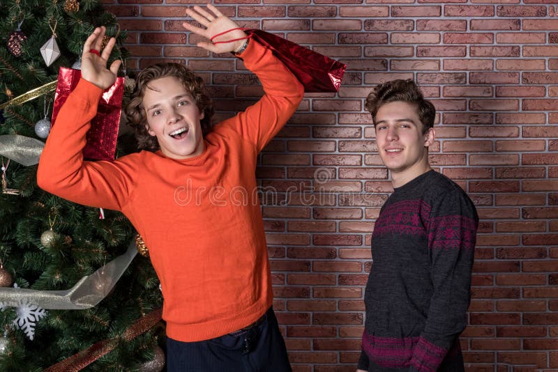 Two Funny Young Men Celebrating Christmas Isolated Over White ...