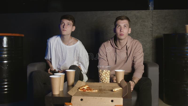 Two Gamers in Front of the Screen are Playing Together in the Online ...