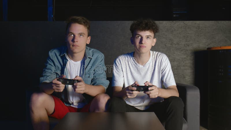 Two Gamers in Front of the Screen are Playing Together in the Online ...