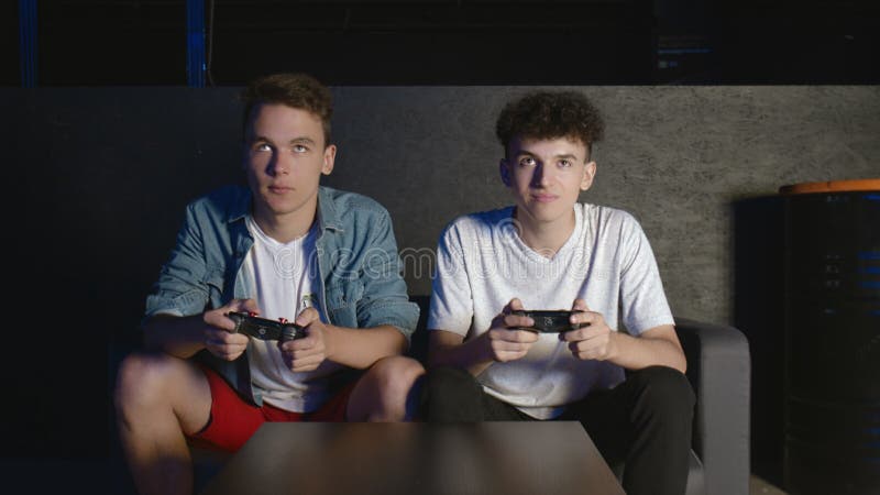Two Gamers in Front of the Screen are Playing Together in the Online ...