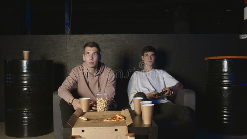 Two Gamers In Front Of The Screen Are Playing Together In The Online ...