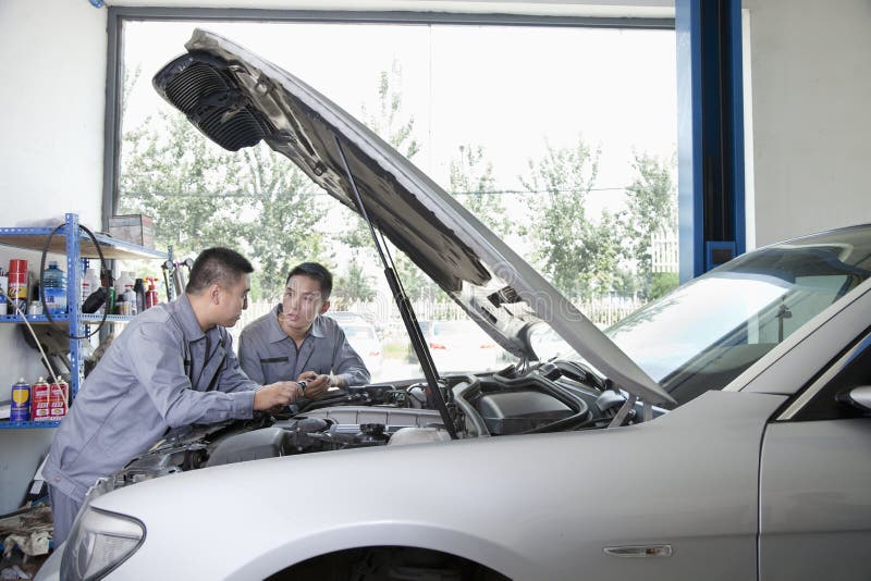 Two Garage Mechanics Working on Engine Stock Image - Image of 4549 ...