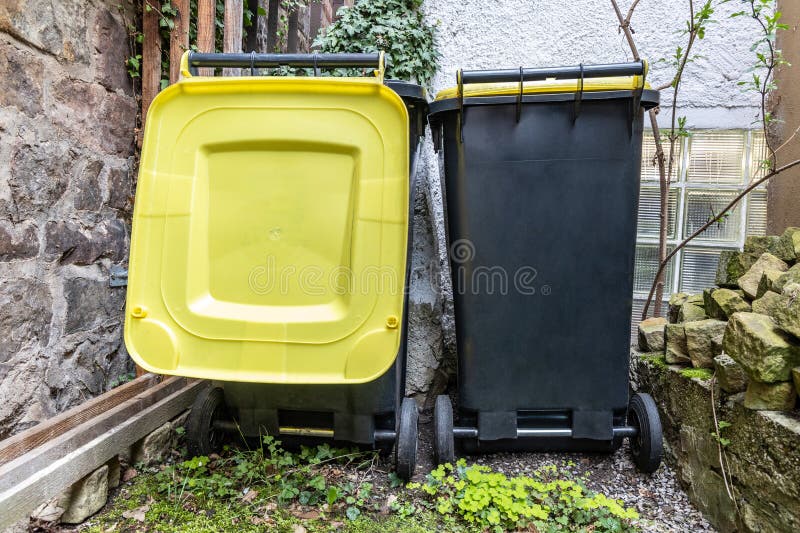 Two Garbage Cans for Plastic are in the Yard Stock Photo - Image of ...