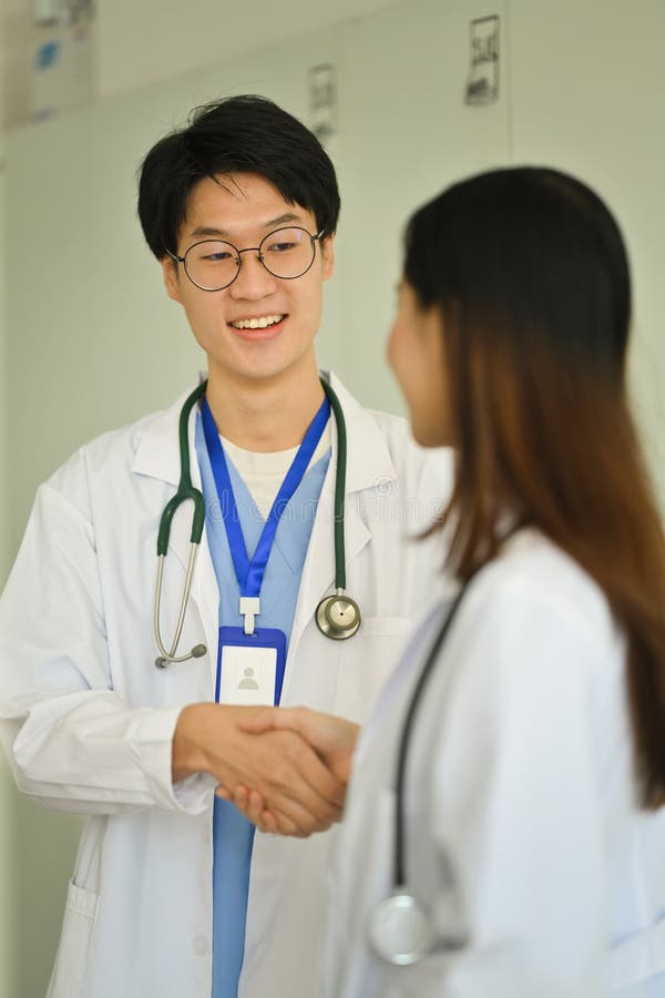Two General Practitioner in White Uniform and Stethoscope Shaking Hands ...