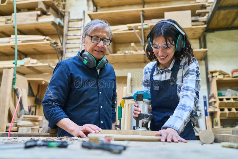 Two Generations Collaborating in a Bustling Lumberyard Workshop Stock ...