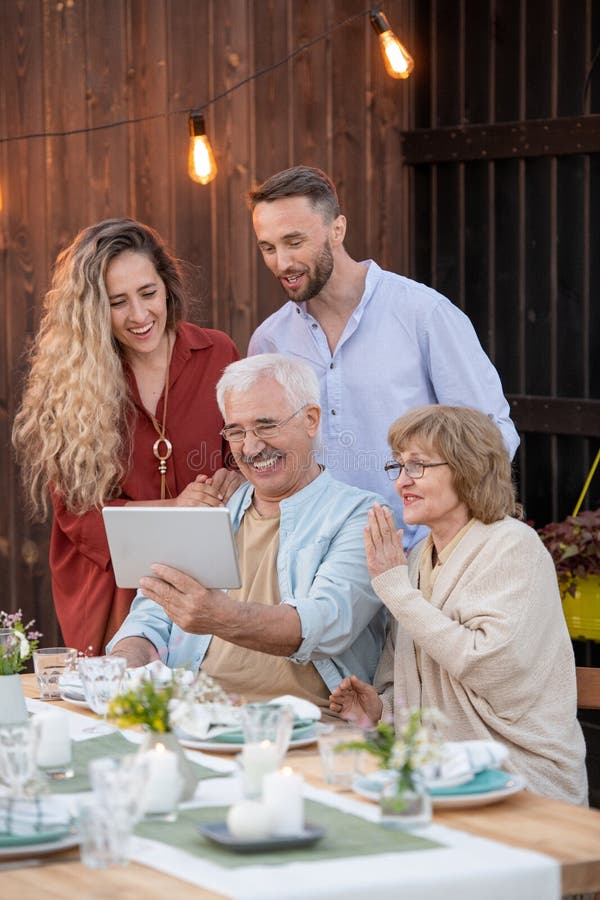 3 generations with tablet stock image. Image of lawn - 69512509