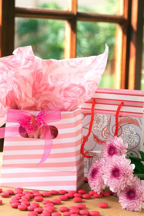 Two Gift Bags with Pink Candy Around Stock Image - Image of giving ...