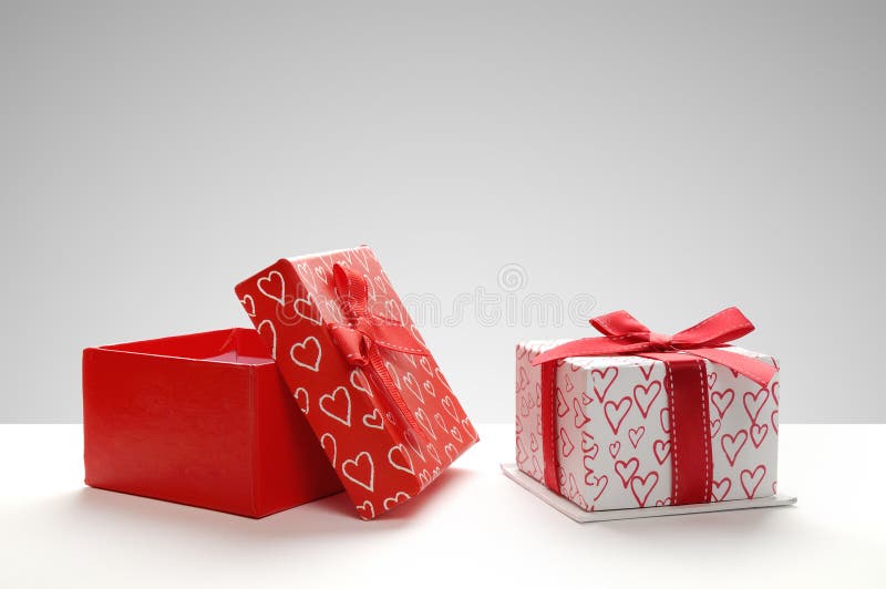 Two Gift Boxes with Hearts Printed with Grey Background Front Stock ...