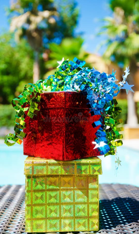 Two Gift Boxes by the Swimming Pool Stock Photo - Image of pool ...
