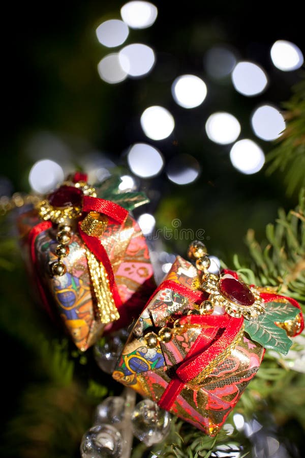 Two Gifts in a Christmas Tree Stock Image - Image of closeup, lights ...